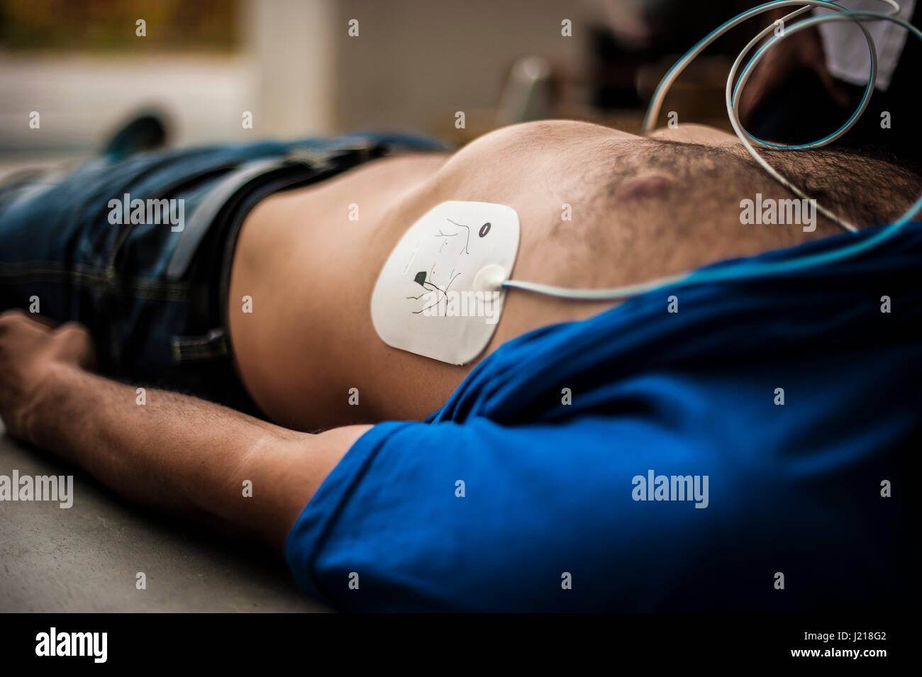 a girl helping a guy after heart attack with cardiopulmonary ...