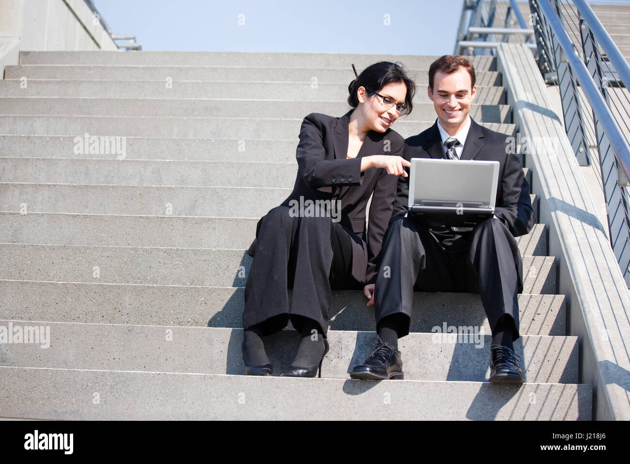 A shot of two business people having a discussion outdoor Stock Photo ...