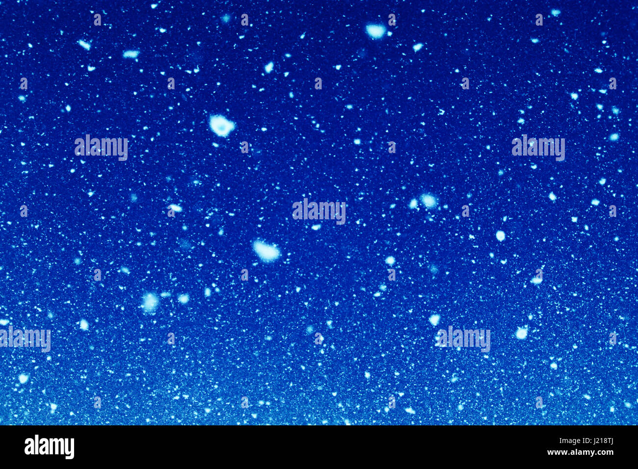 Falling snow flakes during the snowfall from the sky Stock Photo - Alamy