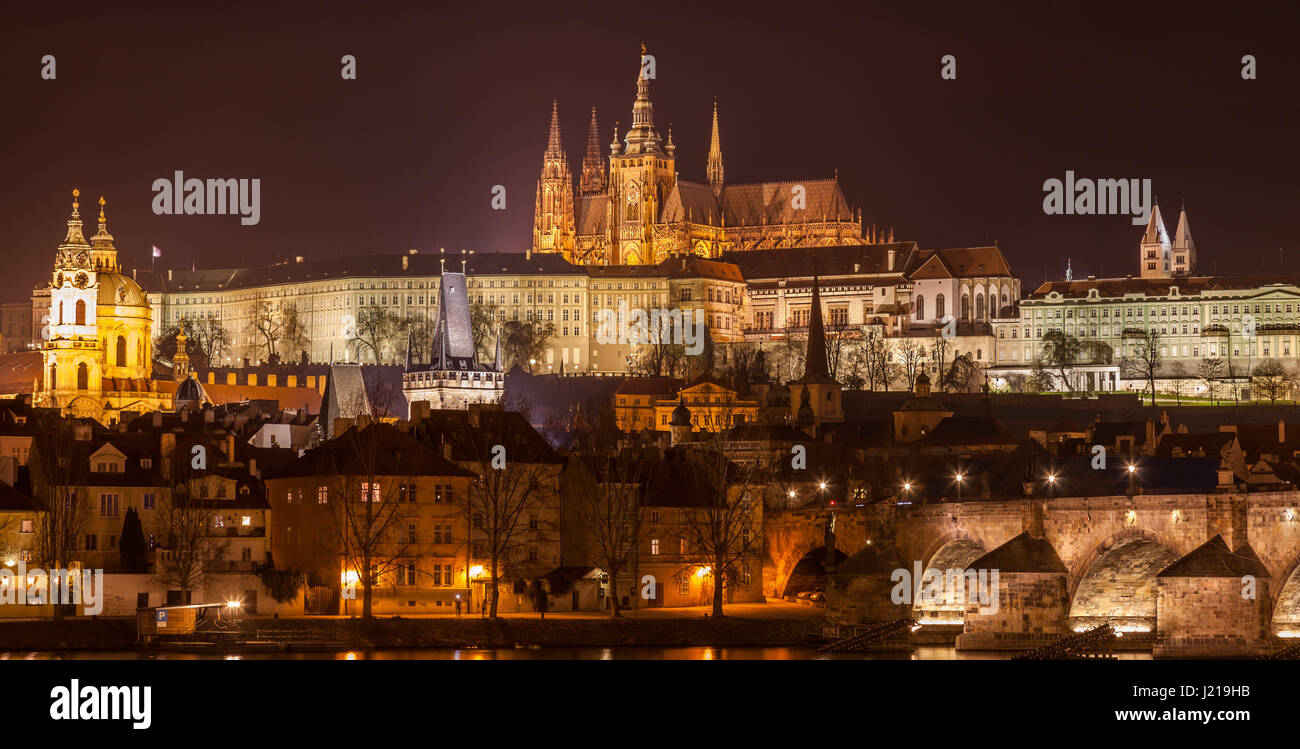 Prague night time cityscape with the Charles bridge and Prague castle ...