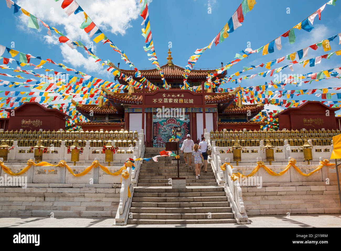 Chinese temple in China with colorful flags under the blue sky Stock ...
