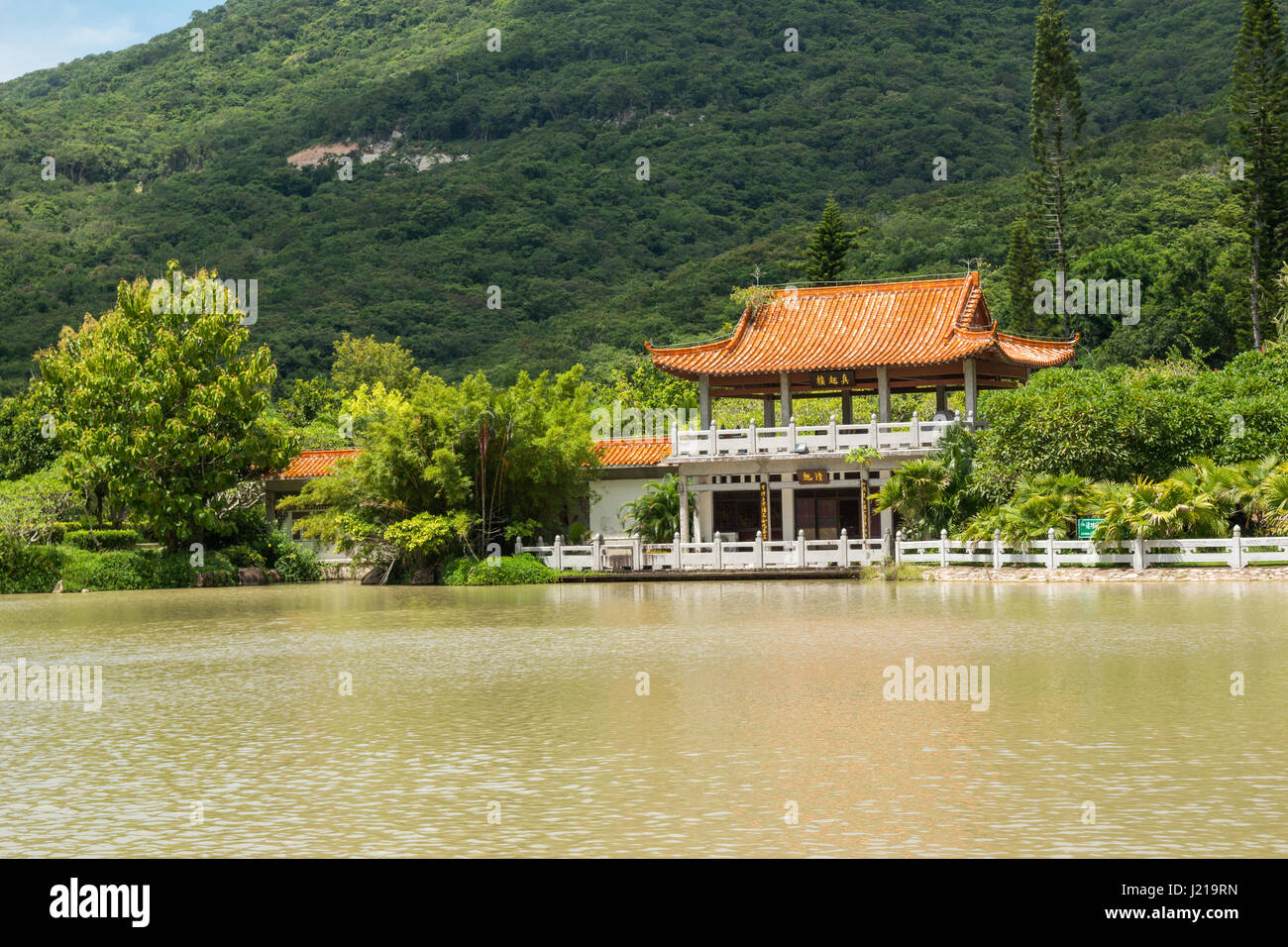 Small chinese house on lake in China Stock Photo - Alamy