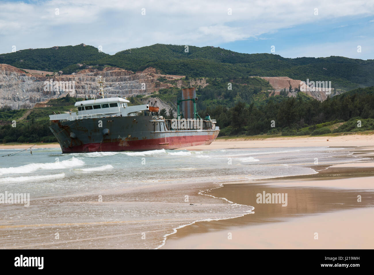 Abandoned Cargo ship sailing on the beach, China Stock Photo - Alamy