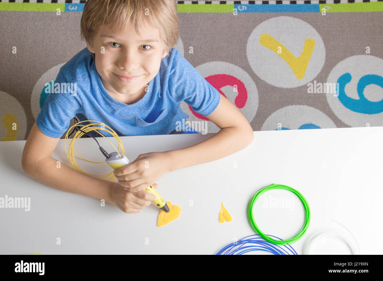 Child using printer at home hi-res stock photography and images - Alamy