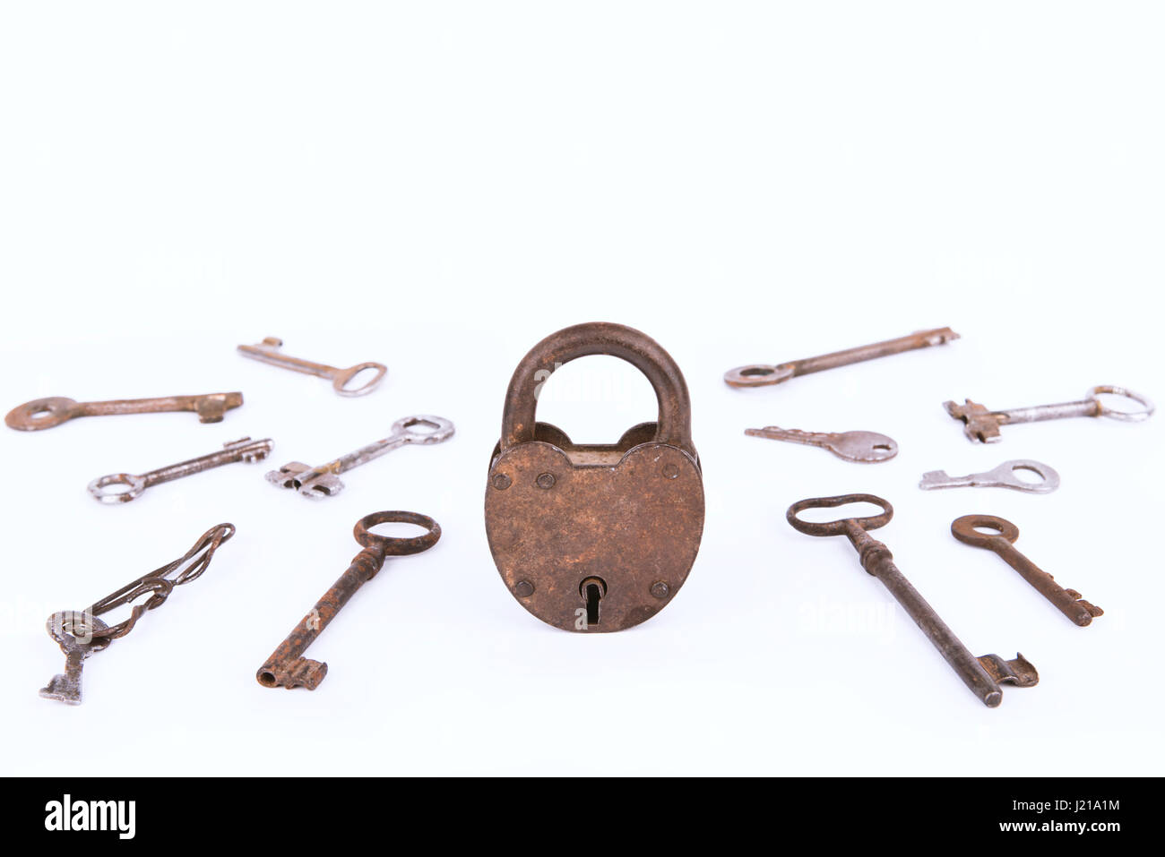 Ancient rusty padlock with collection of keys isolated on white ...