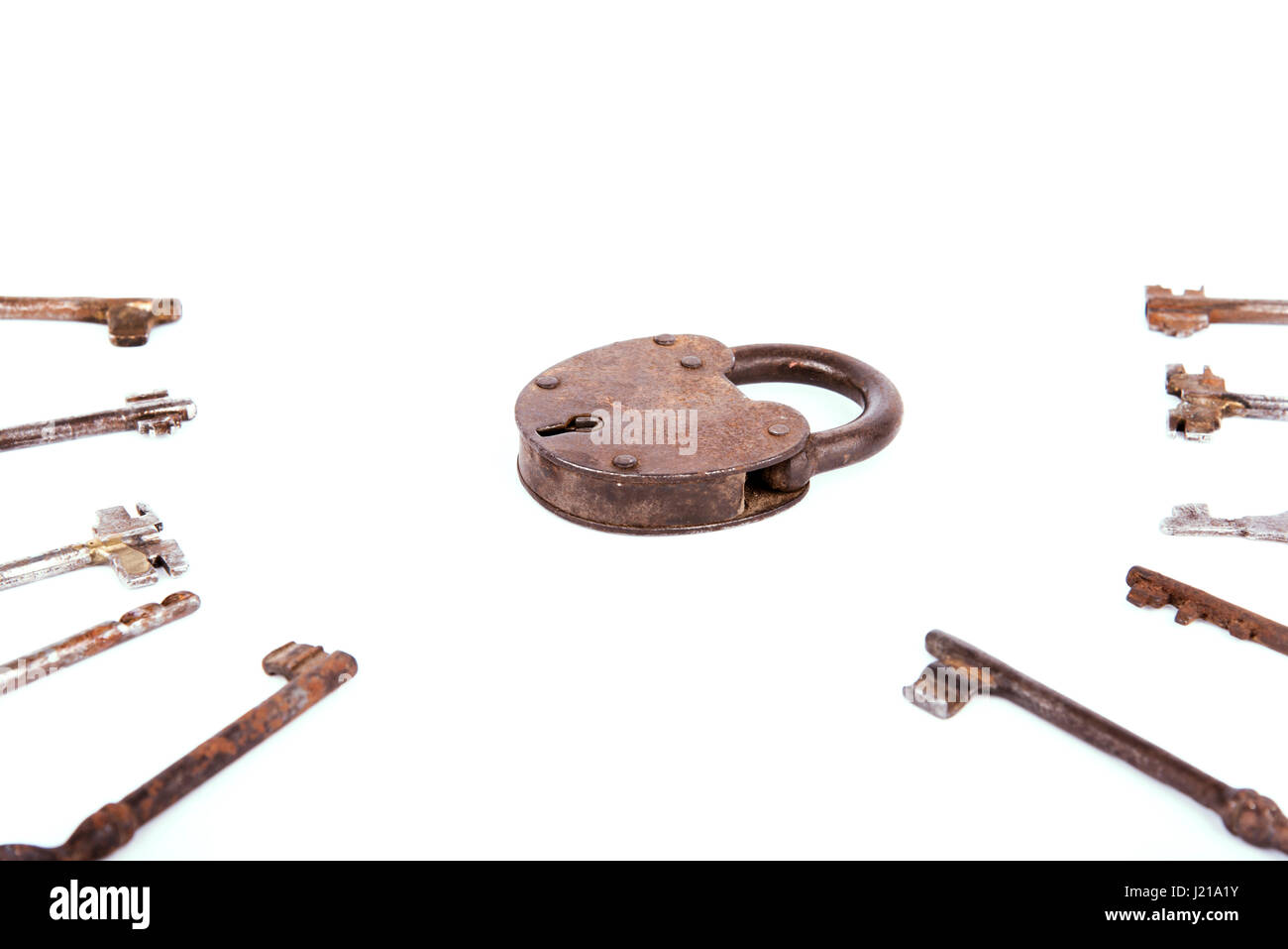 Ancient rusty padlock with collection of keys isolated on white ...