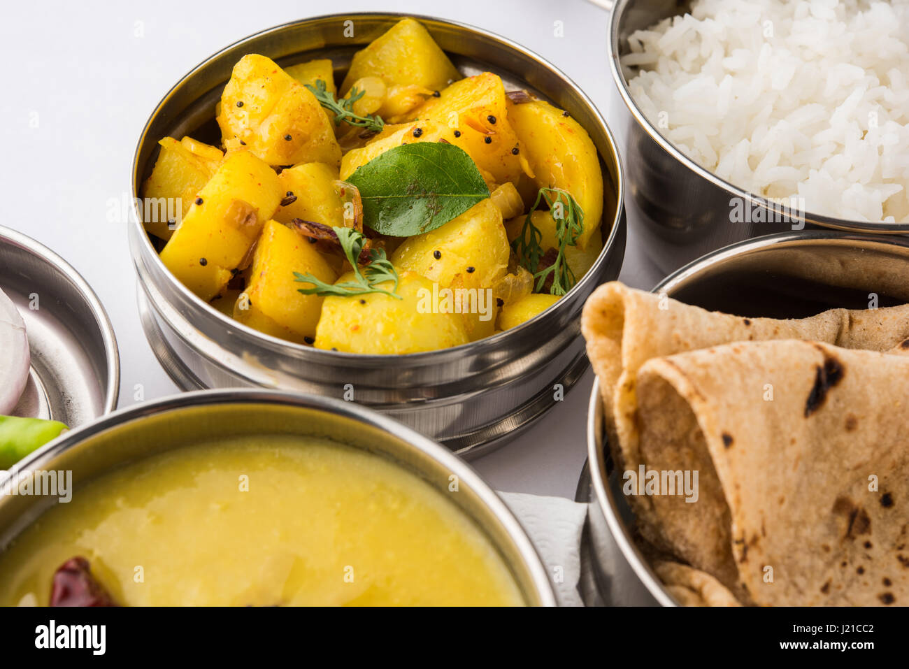 indian typical stainless steel lunch box or tiffin with north indian or ...