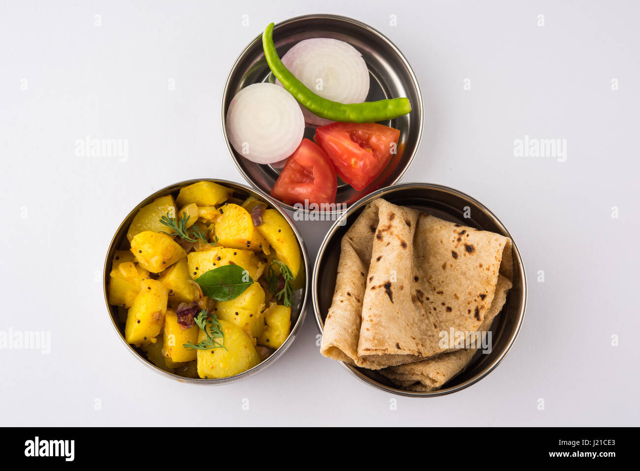 indian typical stainless steel lunch box or tiffin with north indian or ...