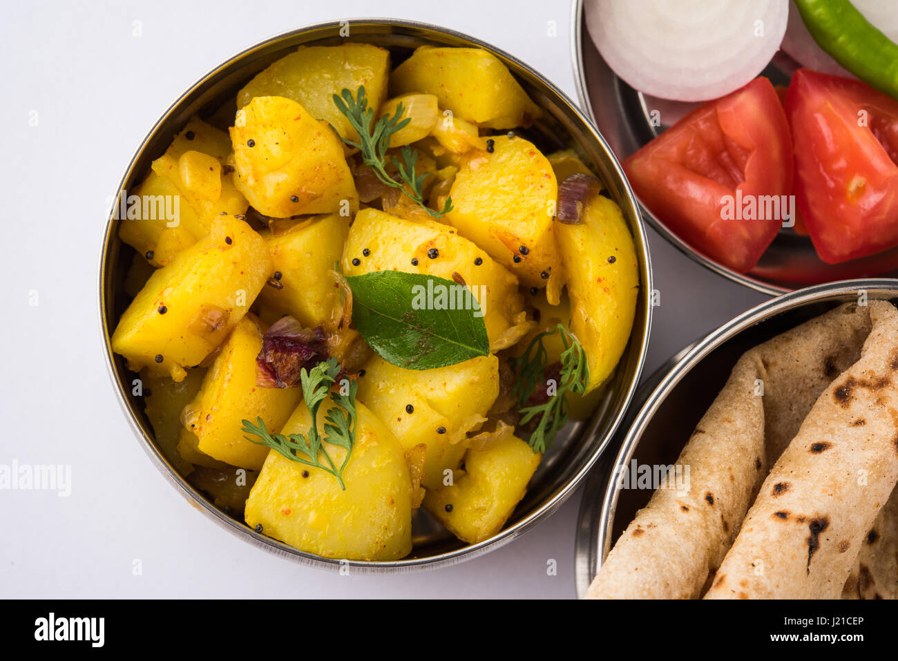 indian typical stainless steel lunch box or tiffin with north indian or ...
