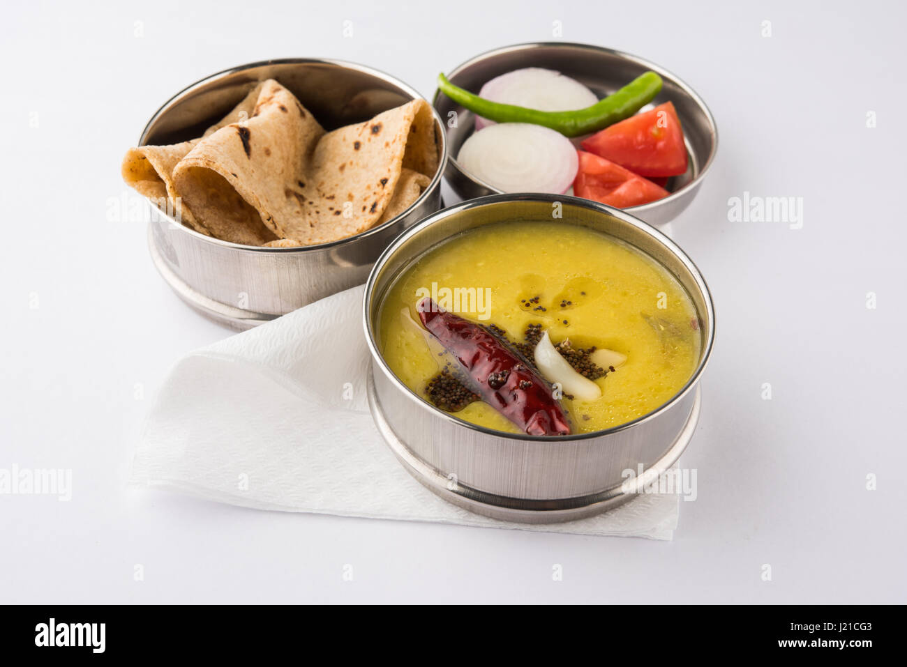 indian typical stainless steel lunch box or tiffin with north indian or ...