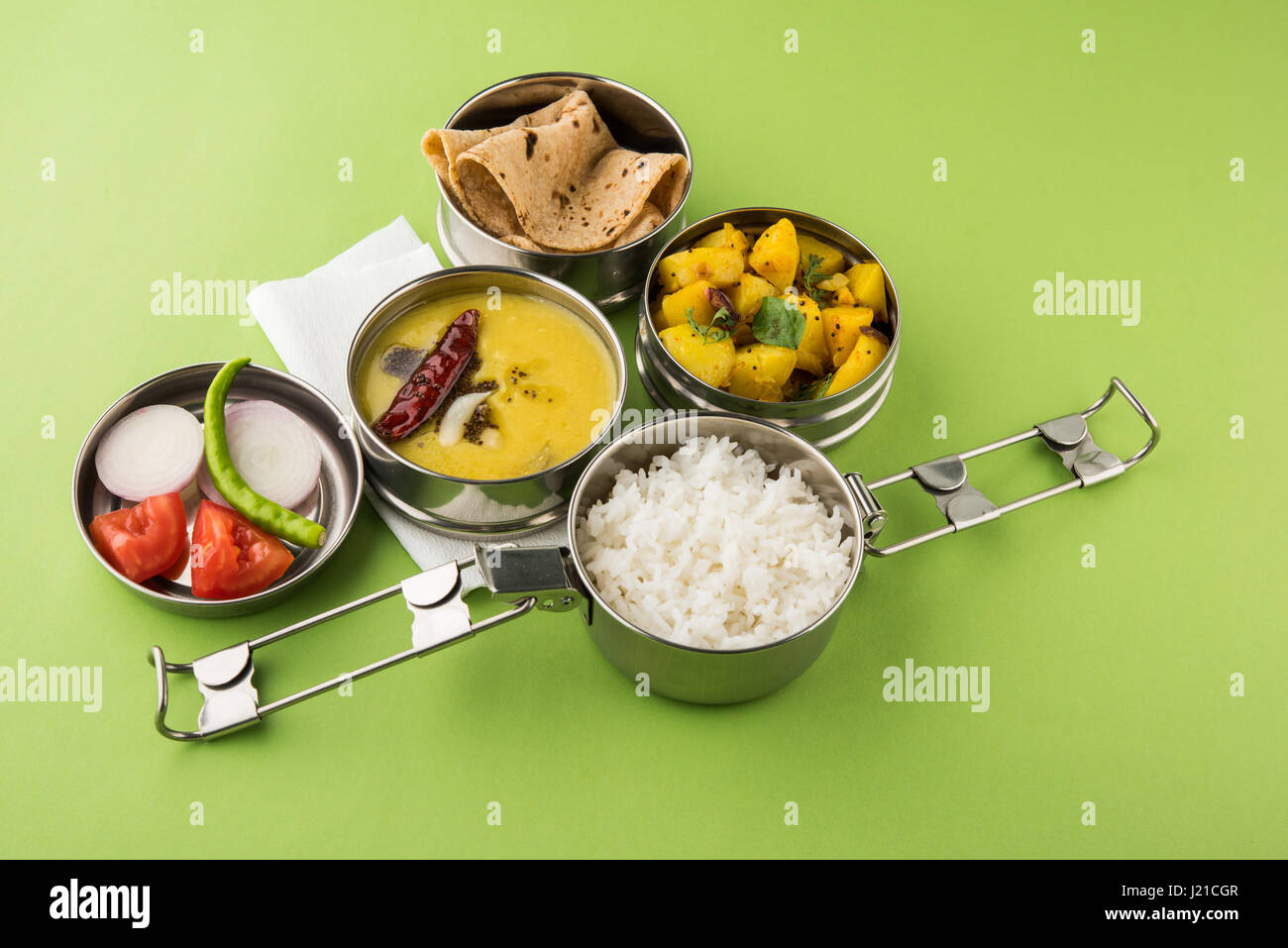 indian typical stainless steel lunch box or tiffin with north indian or ...