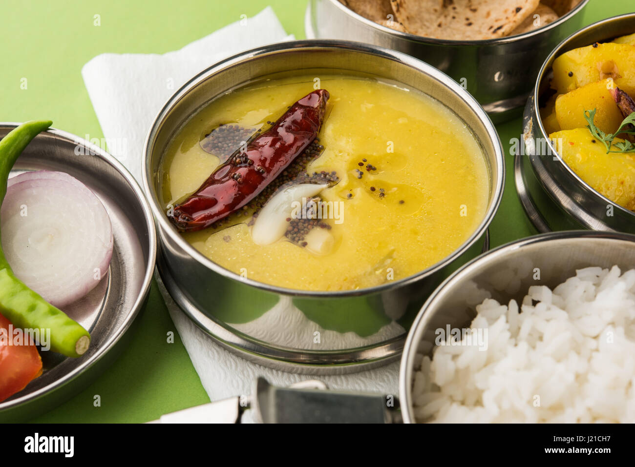 indian typical stainless steel lunch box or tiffin with north indian or ...