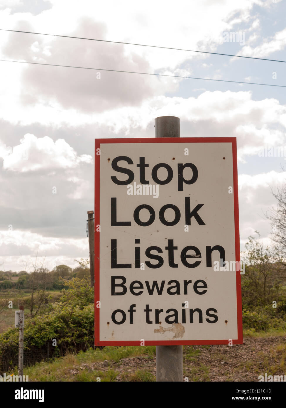 A Railway Safety Sign Saying Stop Look Listen Beware of Train Red and ...