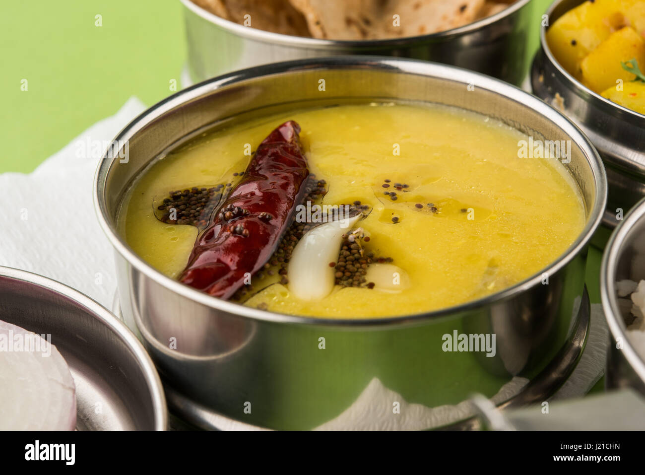 indian typical stainless steel lunch box or tiffin with north indian or ...
