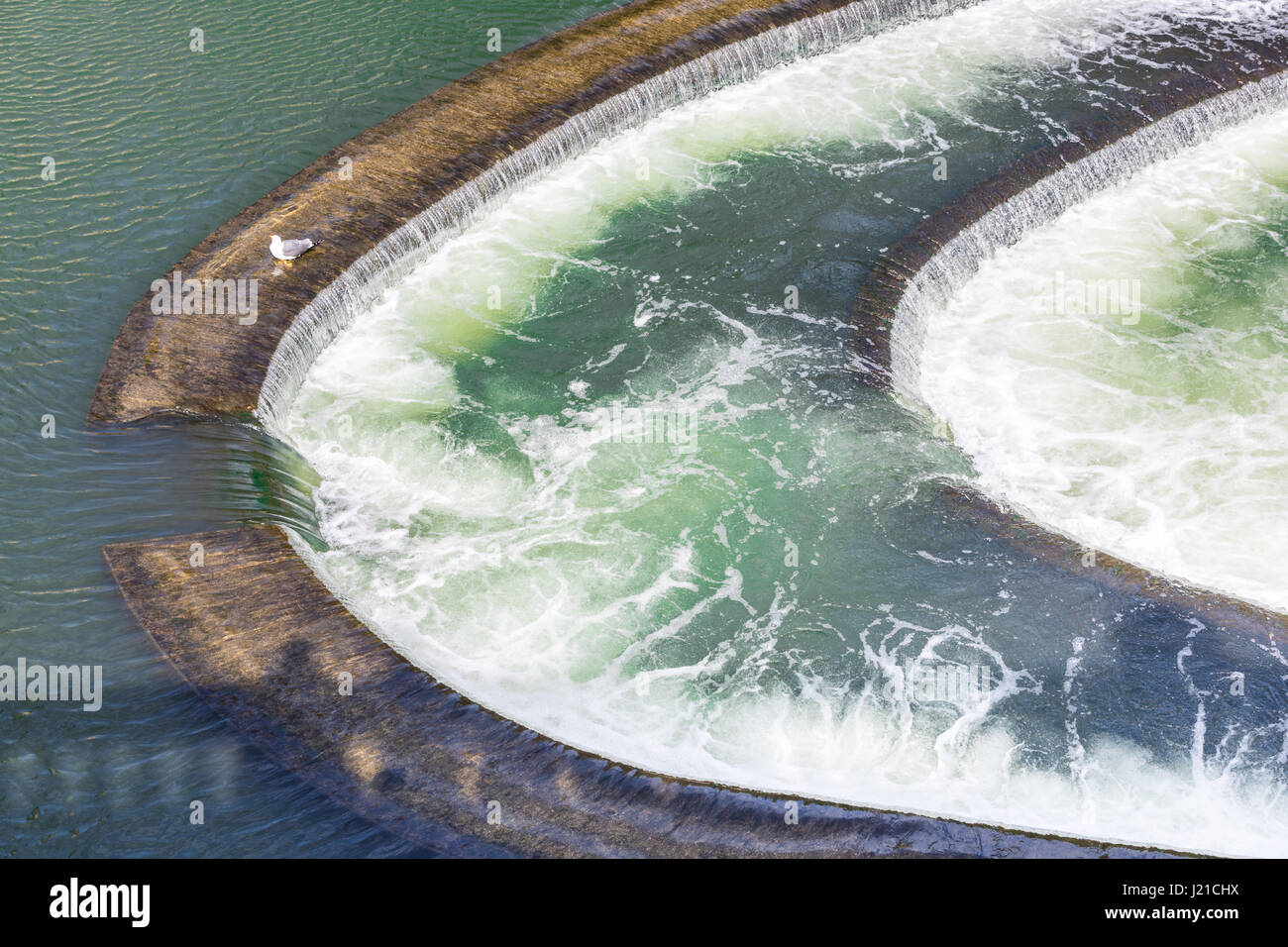 a detail image of the waterfall near Pulteney Bridge in Bath, Somerset ...