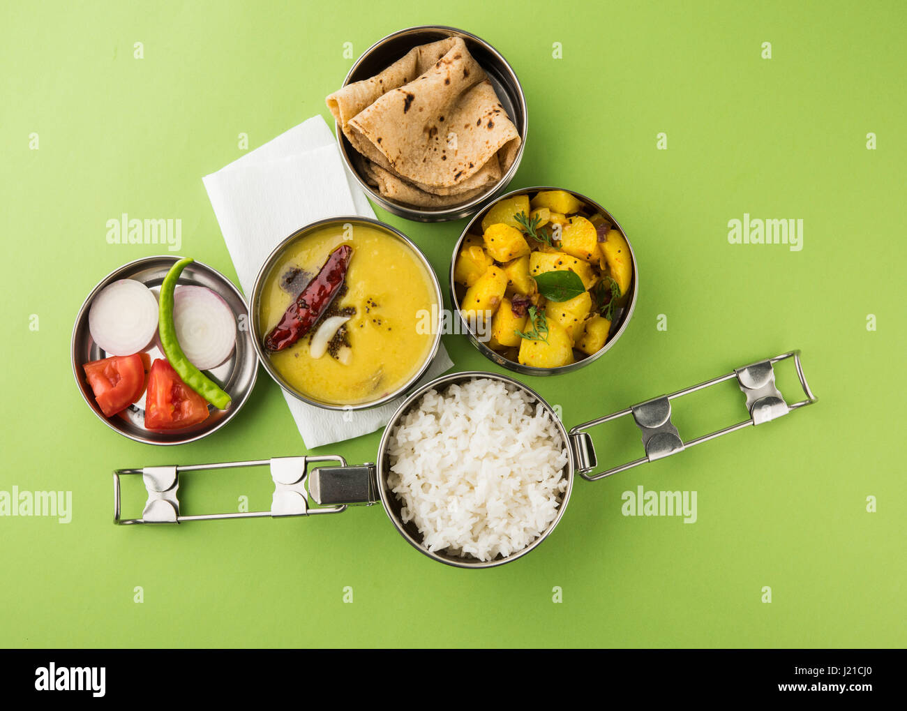 indian typical stainless steel lunch box or tiffin with north indian or ...