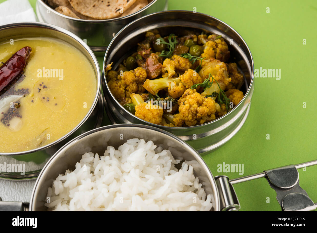 indian typical stainless steel lunch box or tiffin with north indian or ...