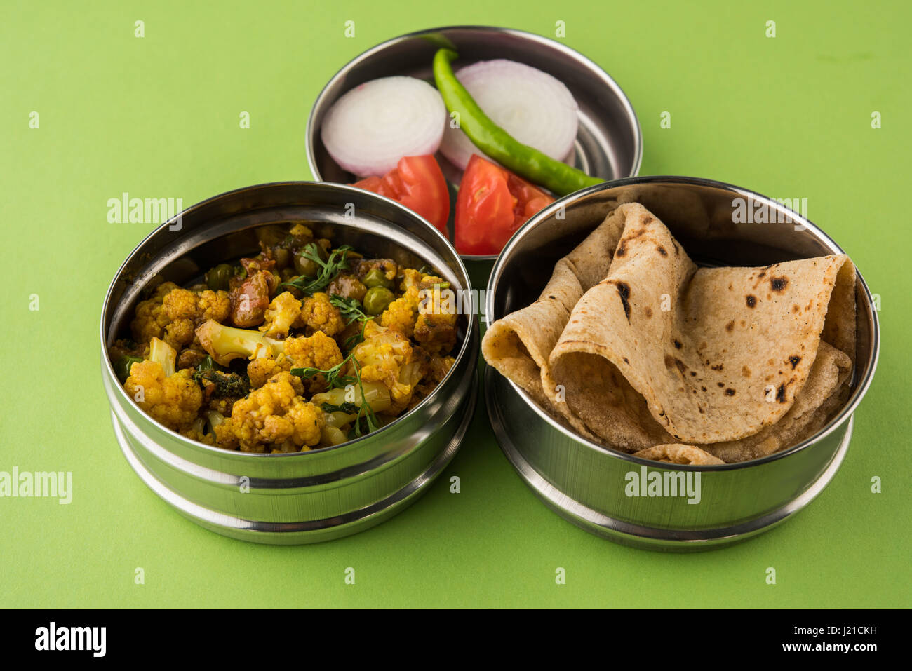 indian typical stainless steel lunch box or tiffin with north indian or ...