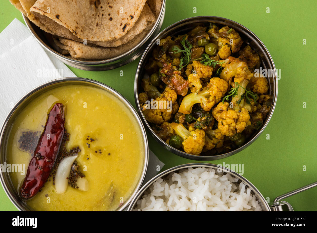 indian typical stainless steel lunch box or tiffin with north indian or ...