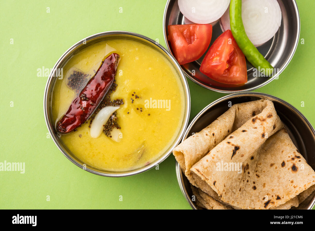 indian typical stainless steel lunch box or tiffin with north indian or ...