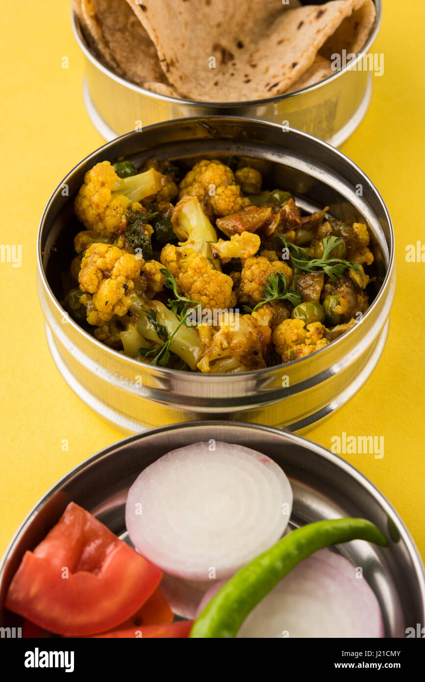 indian typical stainless steel lunch box or tiffin with north indian or ...