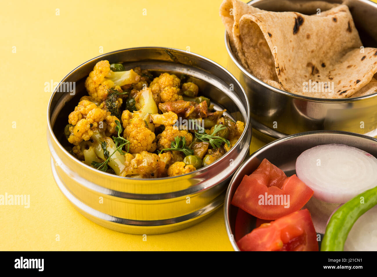 indian typical stainless steel lunch box or tiffin with north indian or ...