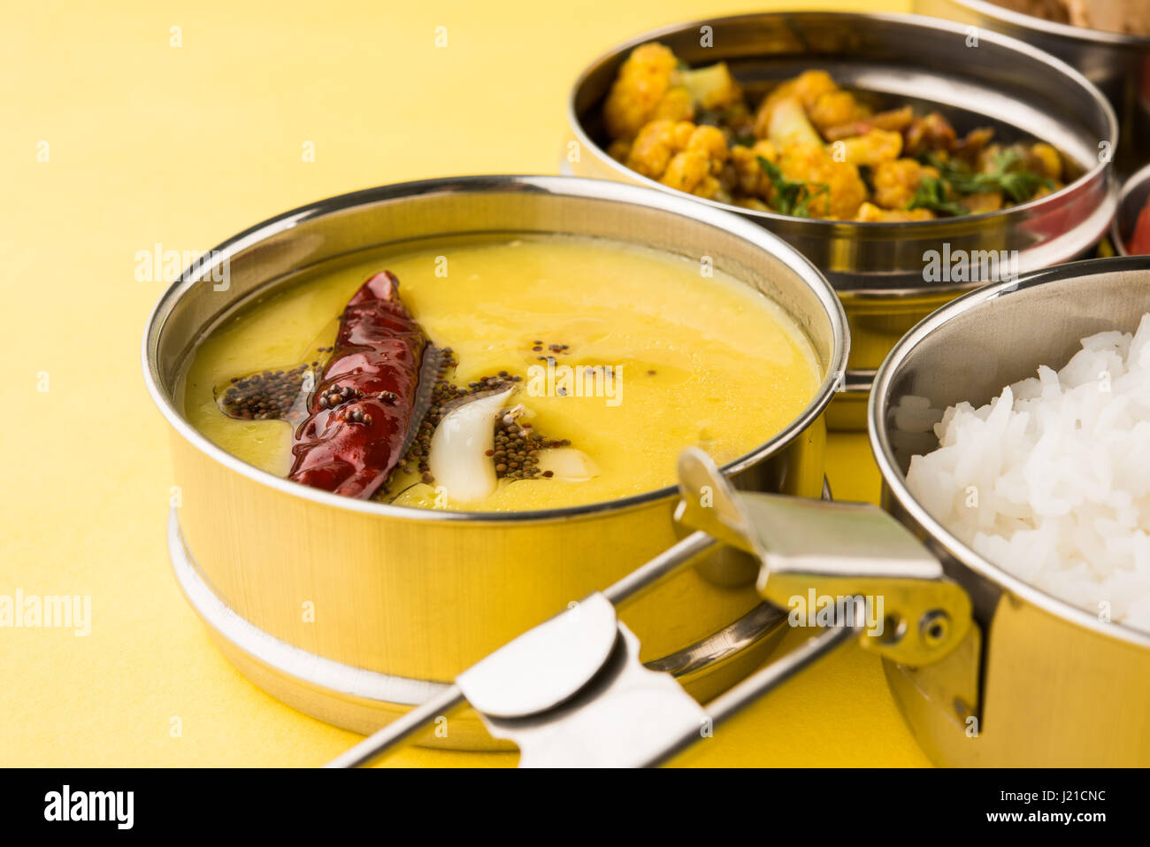 indian typical stainless steel lunch box or tiffin with north indian or ...