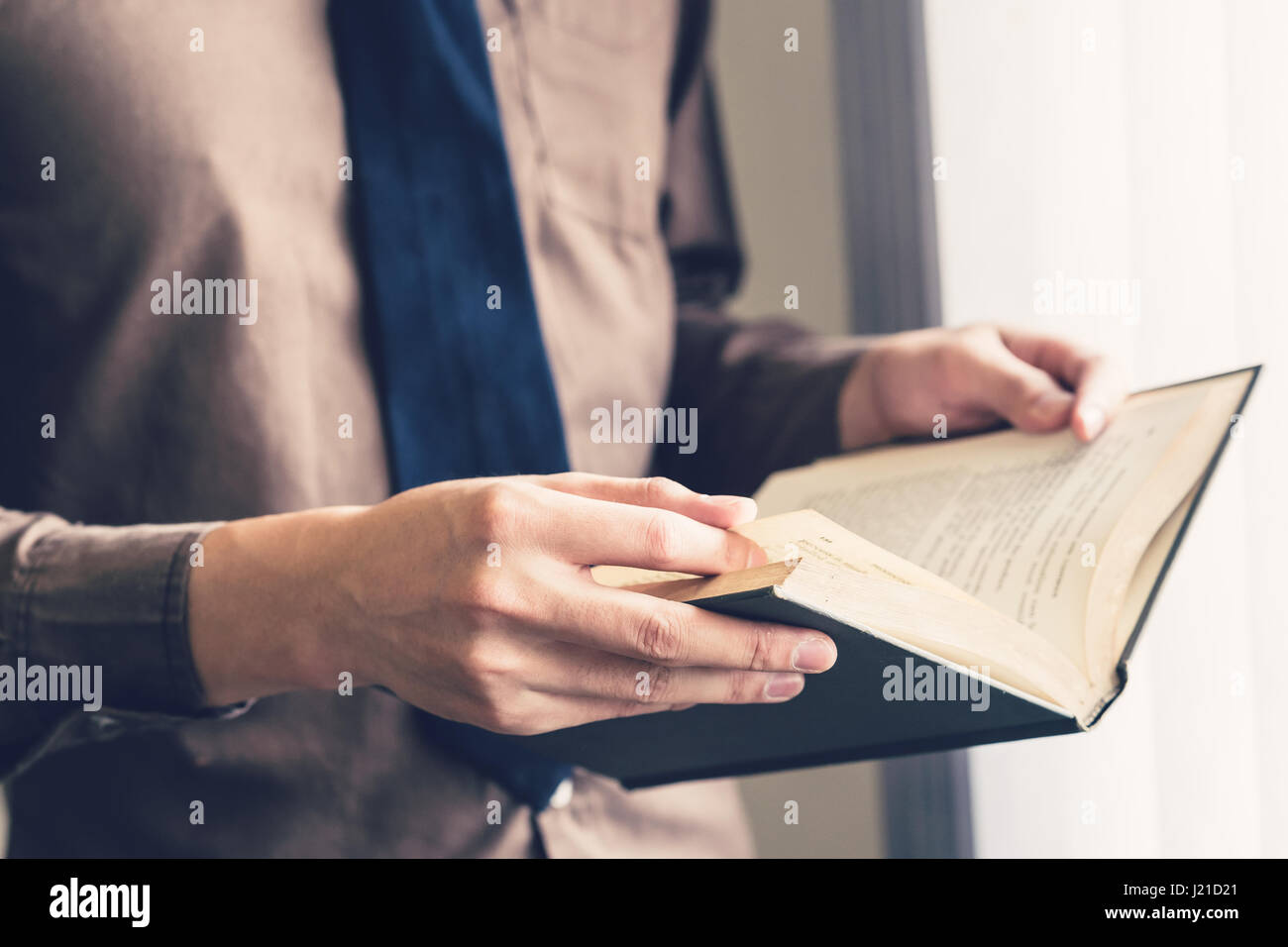 Professional man with book hi-res stock photography and images - Alamy