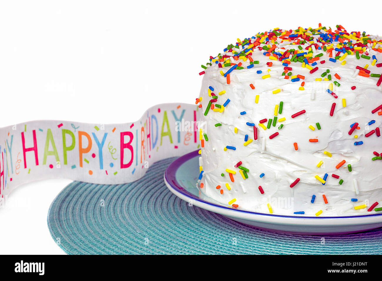 birthday party streamer with white cake and candy sprinkles Stock Photo ...
