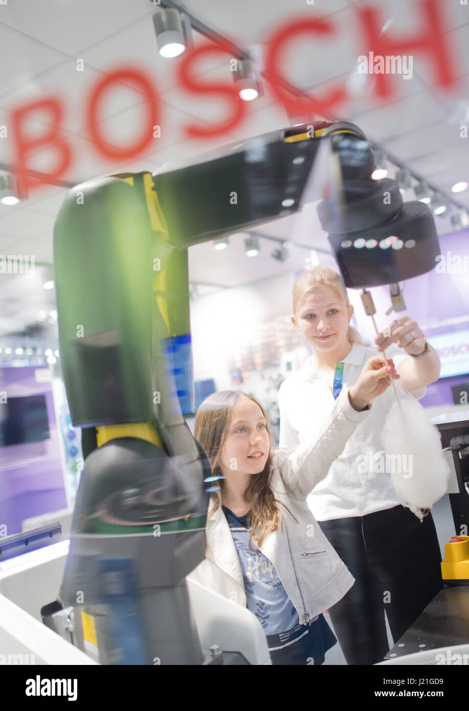Hanover, Germany. 23rd Apr, 2017. A robot hands over candy floss to ...