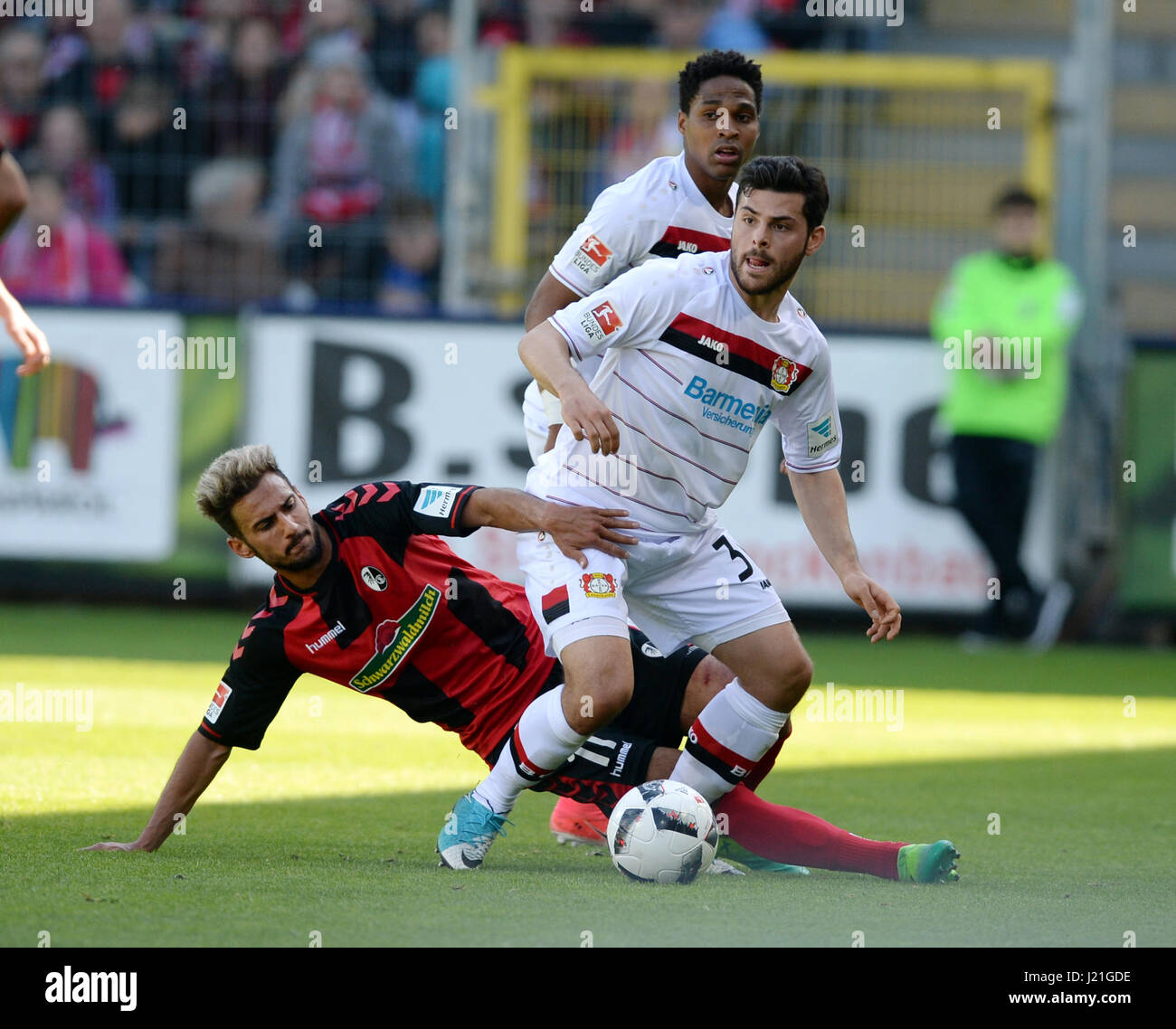Freiburg's Onur Bulut (l) and Leverkusen's Kevin Volland (r) in action ...