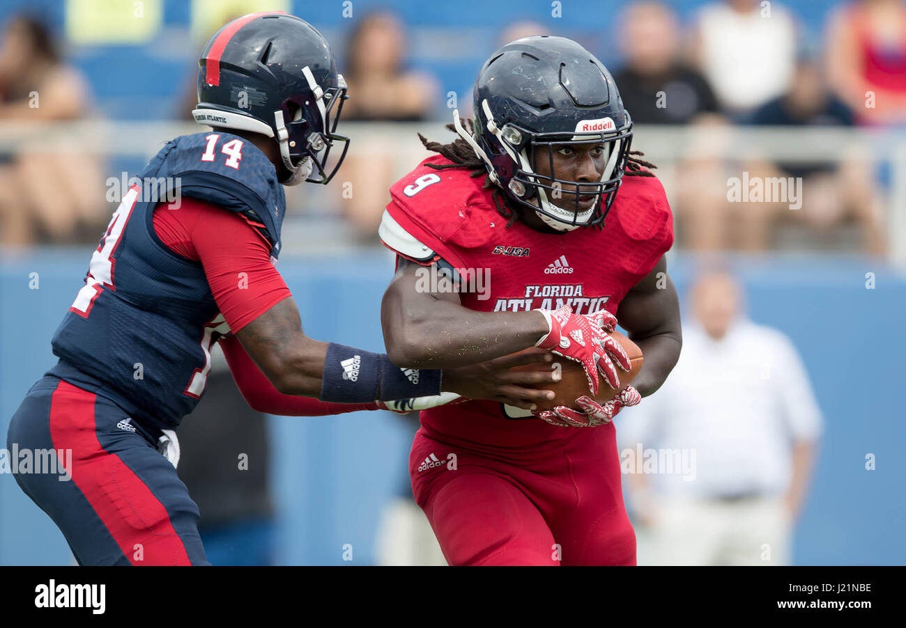 Boca Raton, Florida, USA. 23rd Apr, 2017. FAU quarterback De'Andre Johnson (14) hands off to ...
