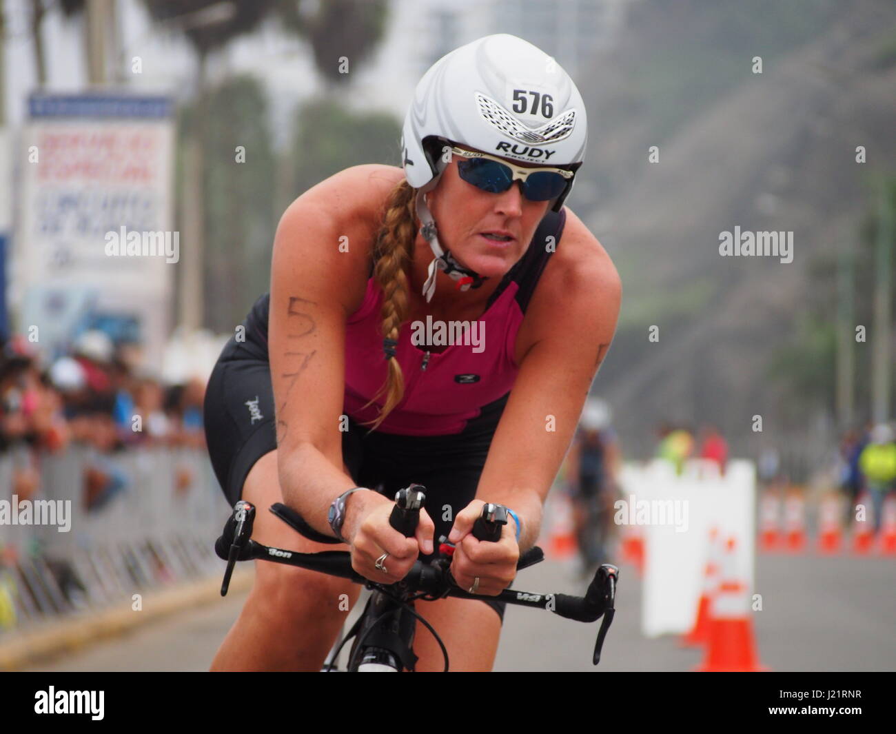 Kathie Sanderson (Canada) riding her bike. Over 1653 athletes ran in ...