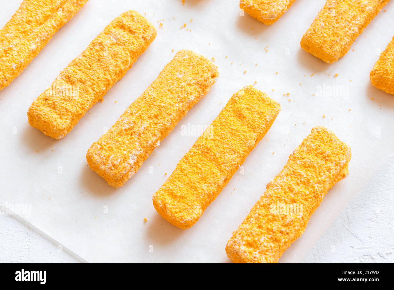 Frozen fish sticks, fish fingers on paper and white background, copy ...