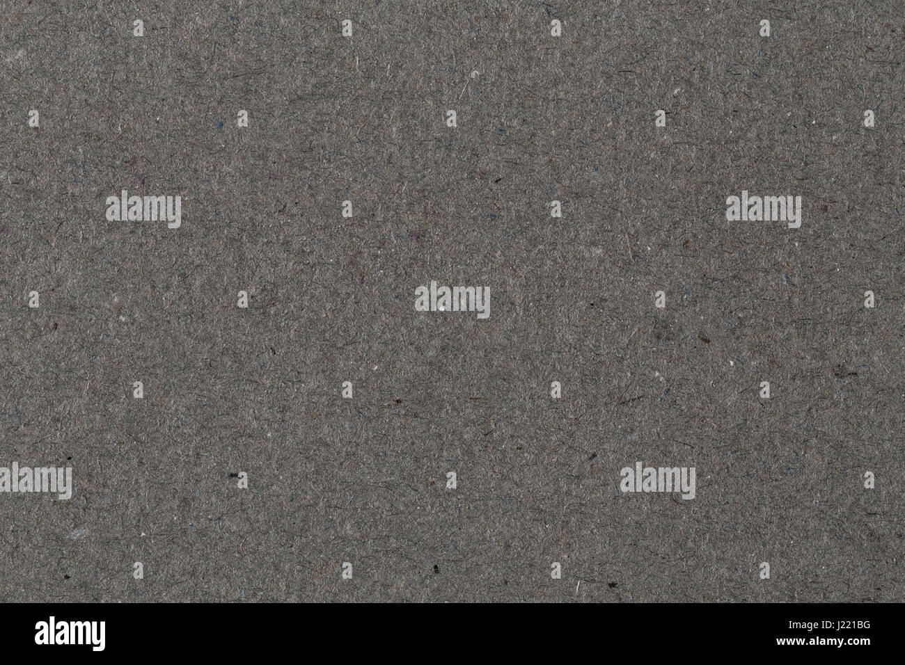 Dense cardboard paper closeup texture or background Stock Photo - Alamy