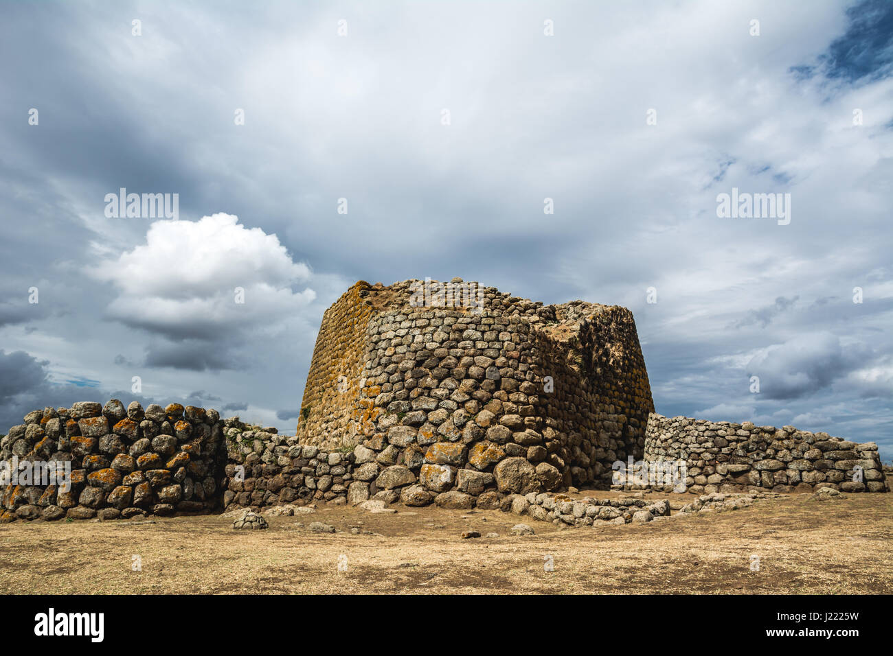 Typical nuraghe site in Sardinia, Italy with picturesque clouds before ...