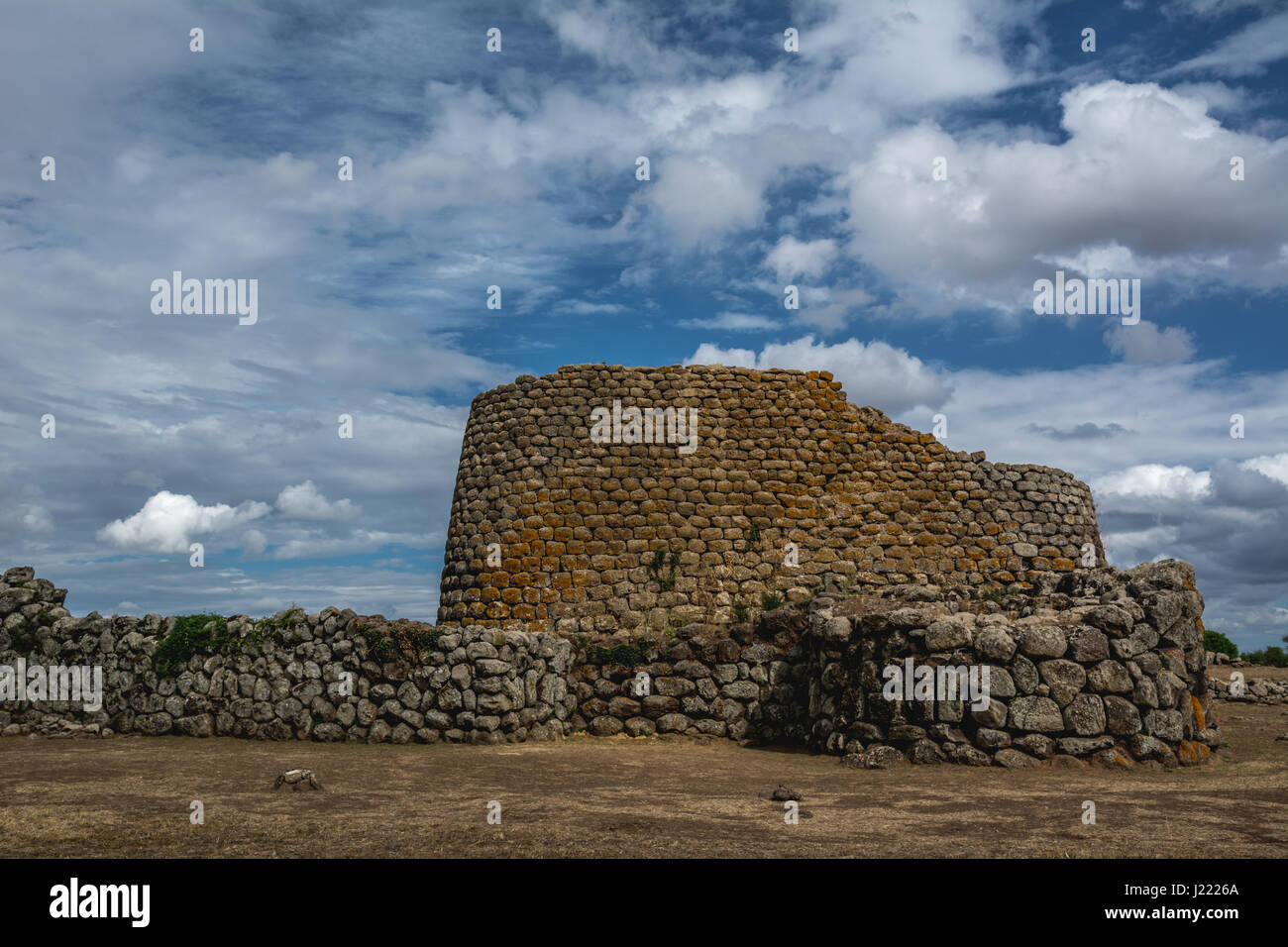 Typical nuraghe site in Sardinia, Italy with picturesque clouds ...