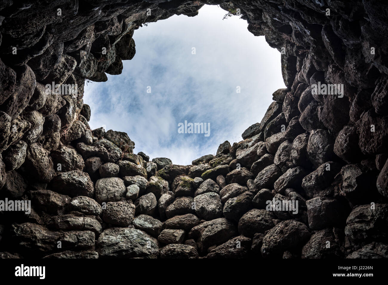 Typical nuraghe interior with overhead opening to allow light in it ...