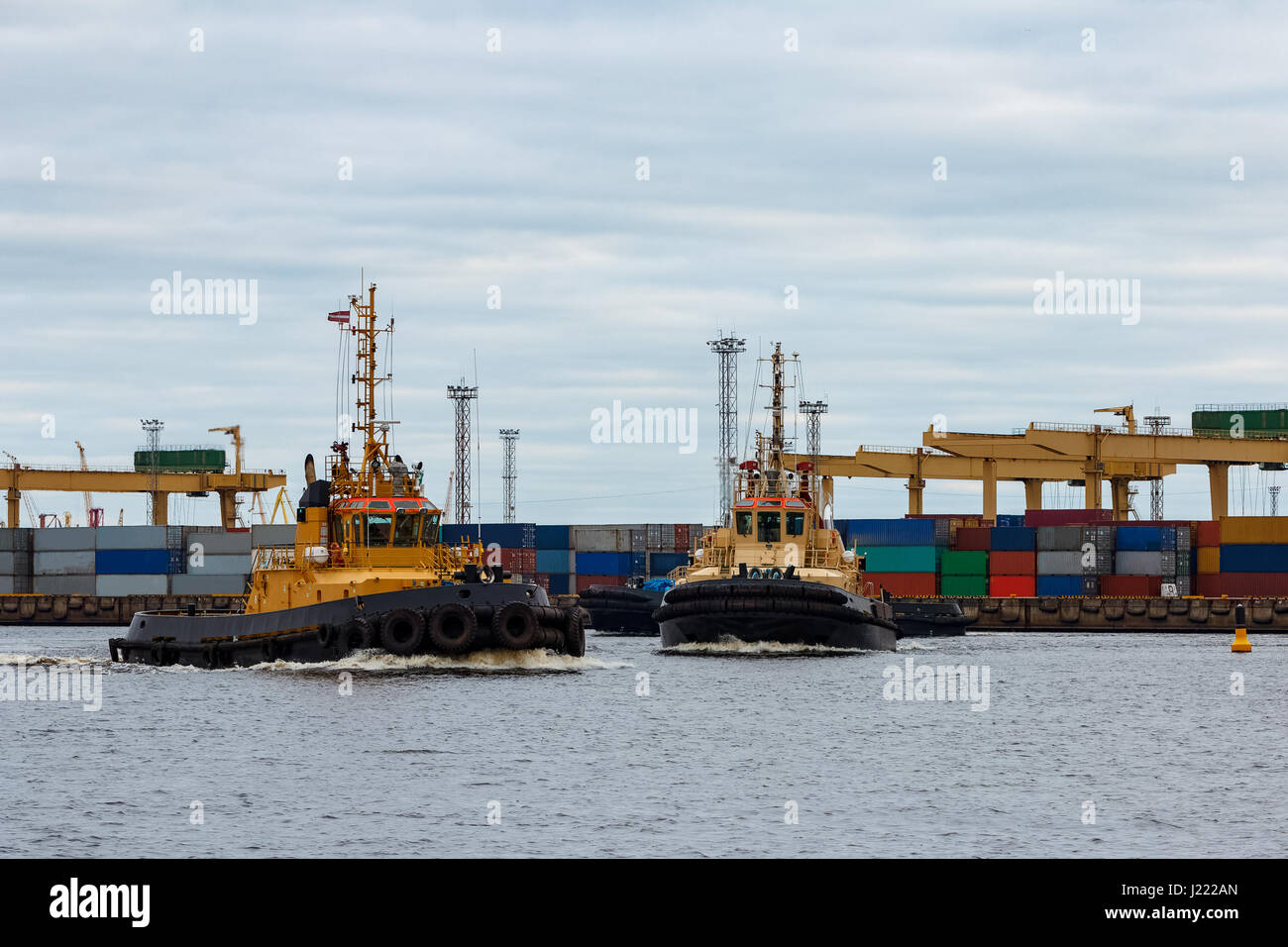 Tug ships in the cargo port of Riga, Europe Stock Photo - Alamy