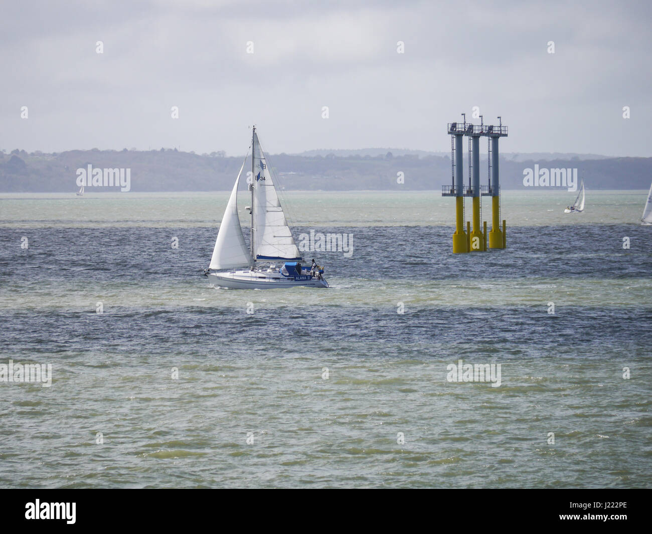 A yacht passes the new navigation beacons in the Solent that are ...