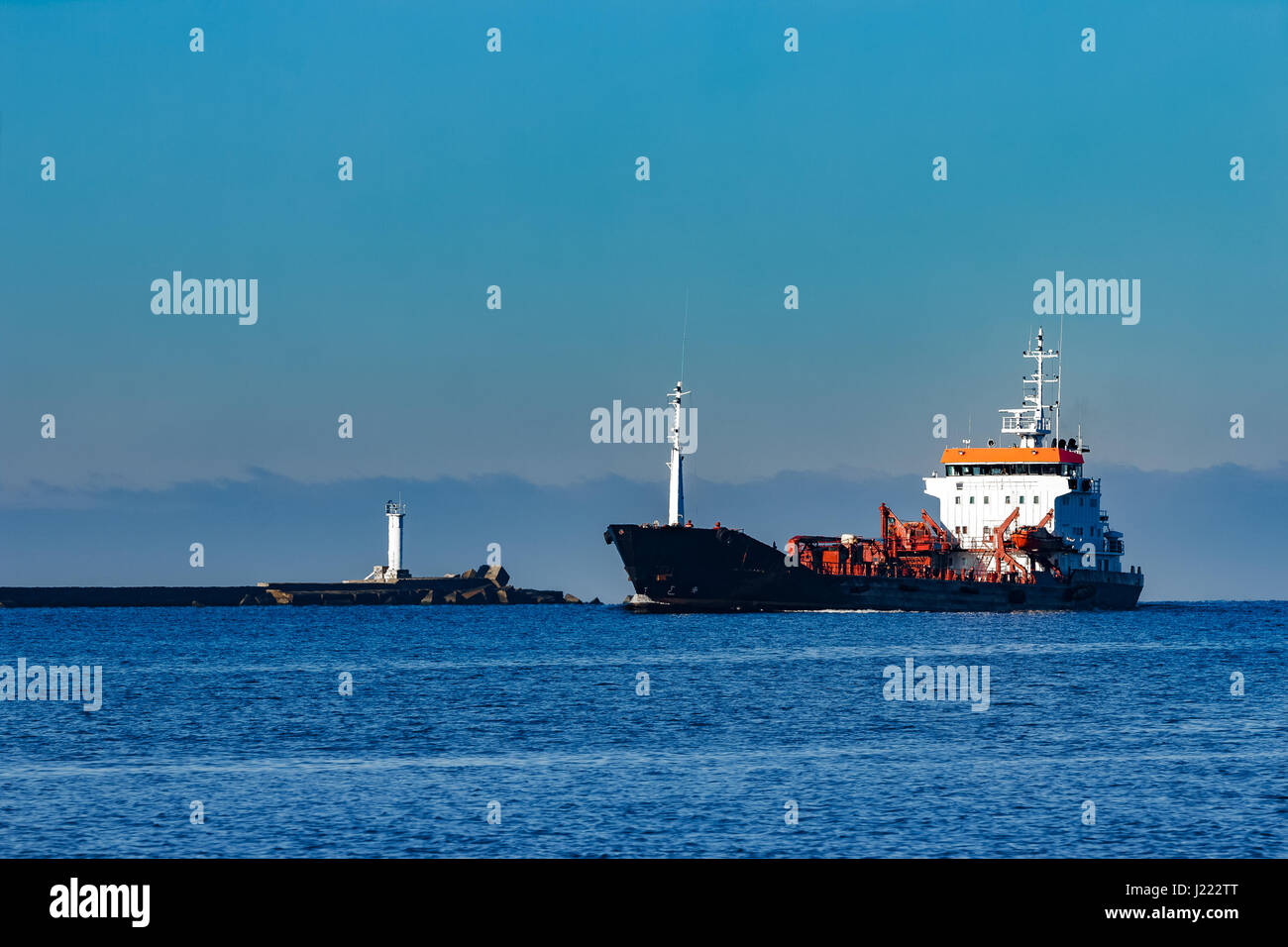 Black cargo oil tanker sailing in still water from Baltic sea Stock ...