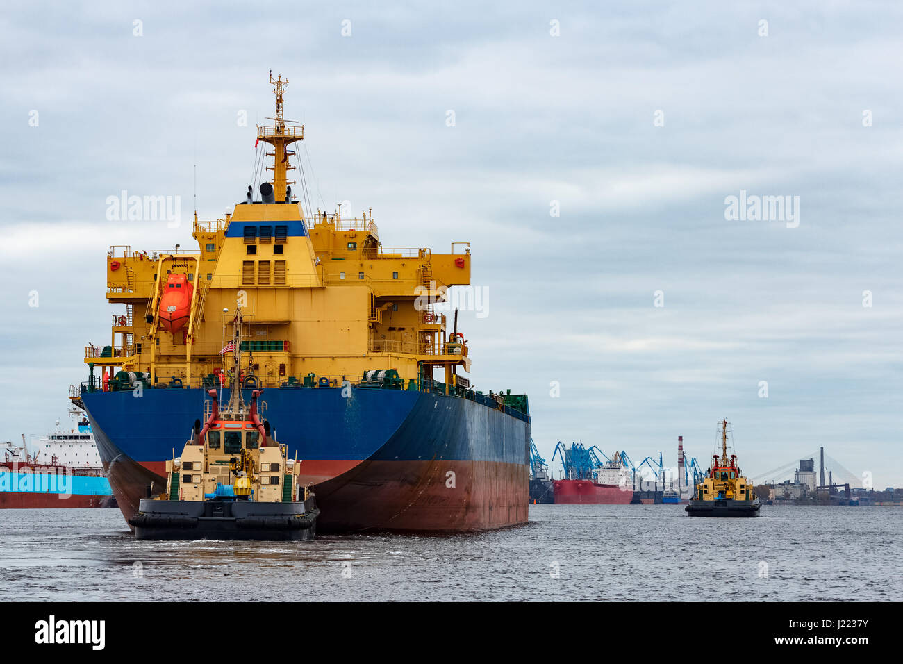 Blue cargo ship entering the port of Riga, Europe Stock Photo - Alamy