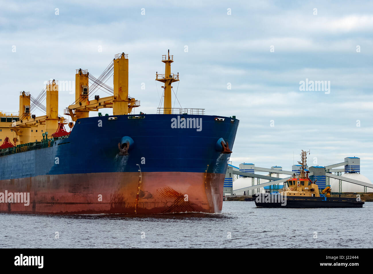 Blue cargo ship entering the port of Riga, Europe Stock Photo - Alamy