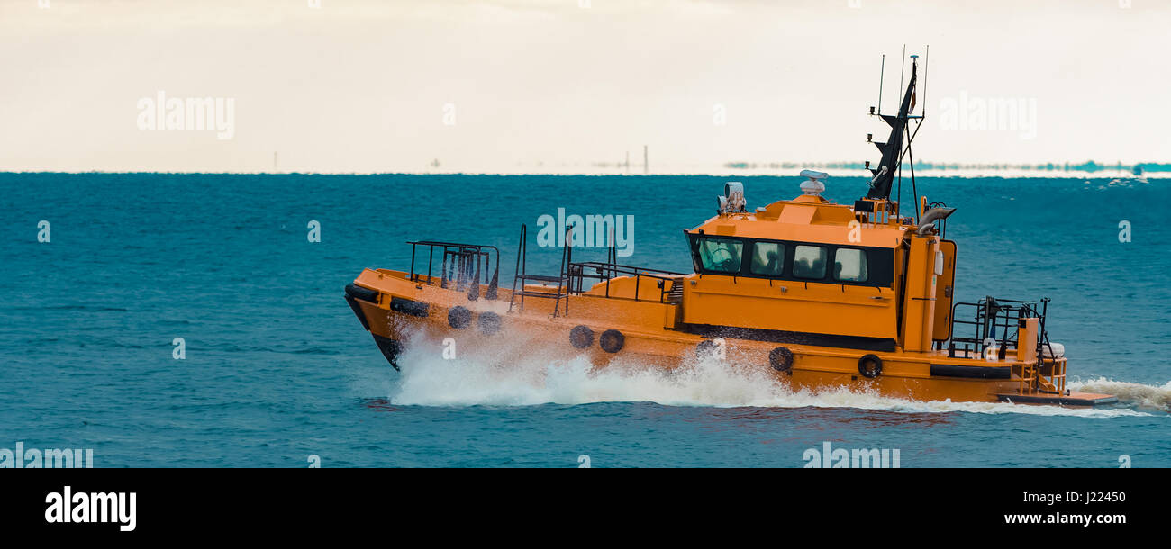 Orange pilot ship moving fast in Baltic sea. Europe Stock Photo - Alamy