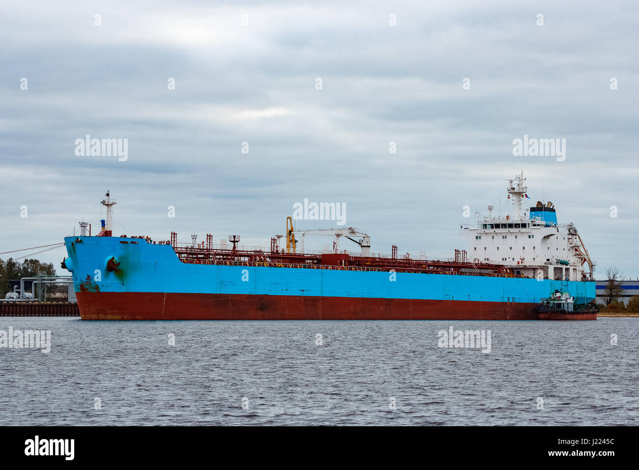 Blue cargo ship loading in the port of Riga, Europe Stock Photo - Alamy