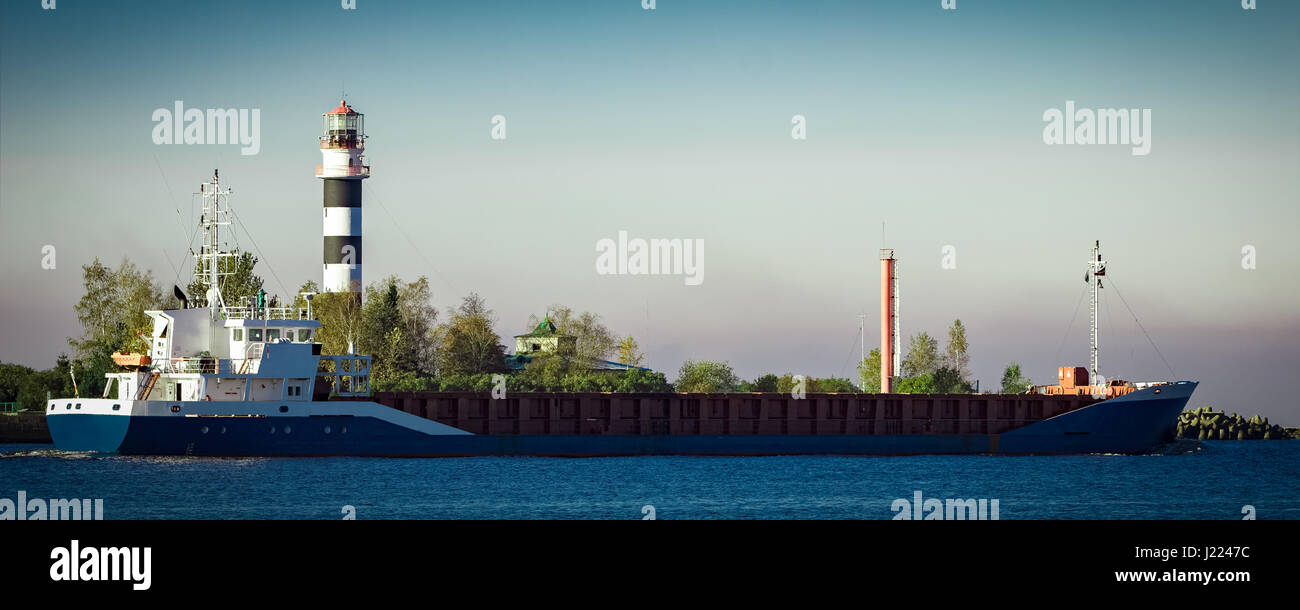 Blue cargo ship leaving Riga and entering Baltic sea Stock Photo - Alamy