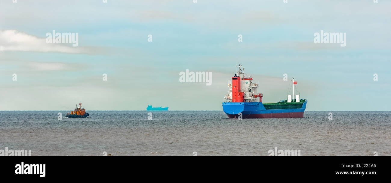 Blue cargo ship entering the Baltic sea. Riga, Europe Stock Photo - Alamy