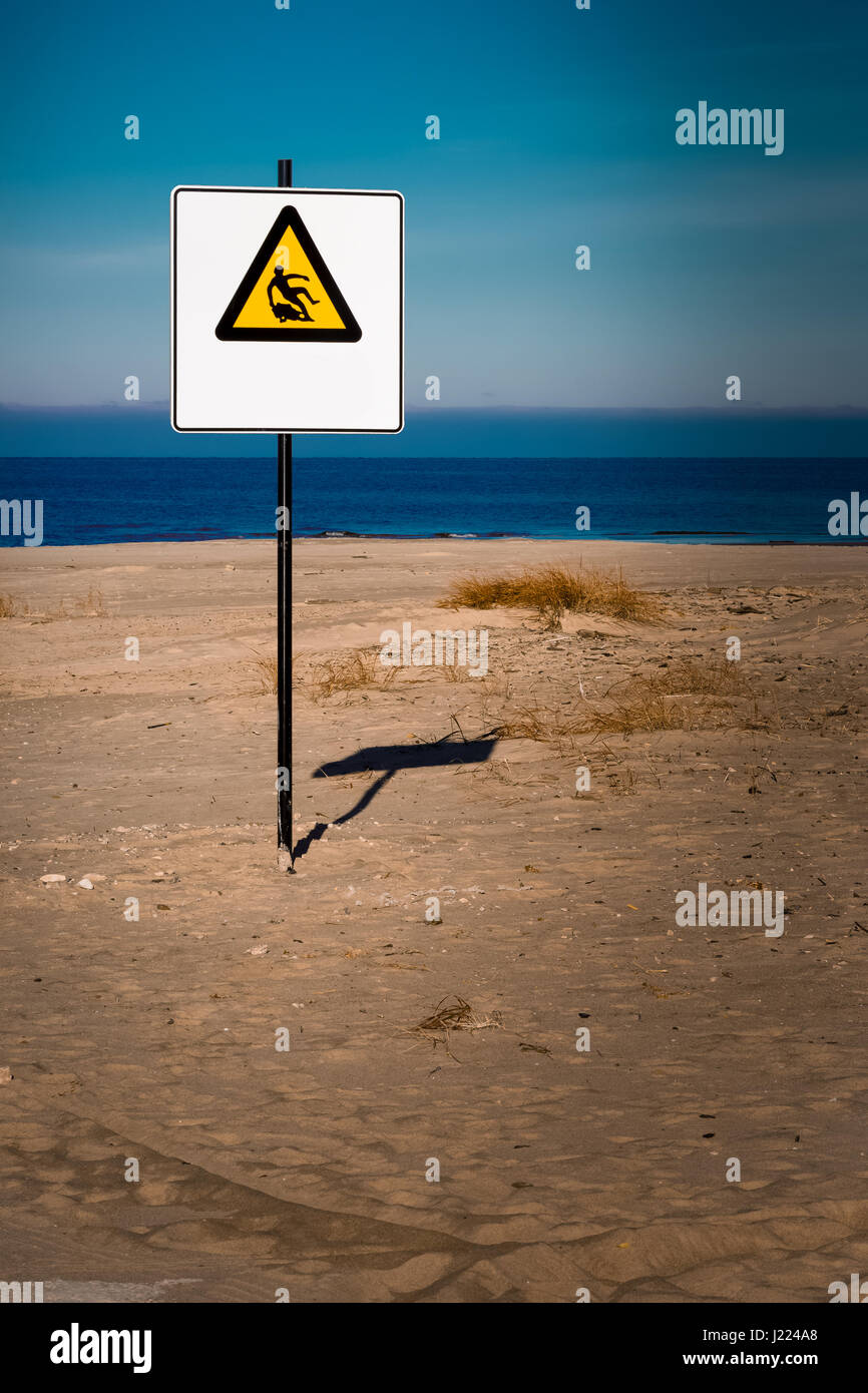 Yellow warning sign on summer beach, Riga Stock Photo - Alamy