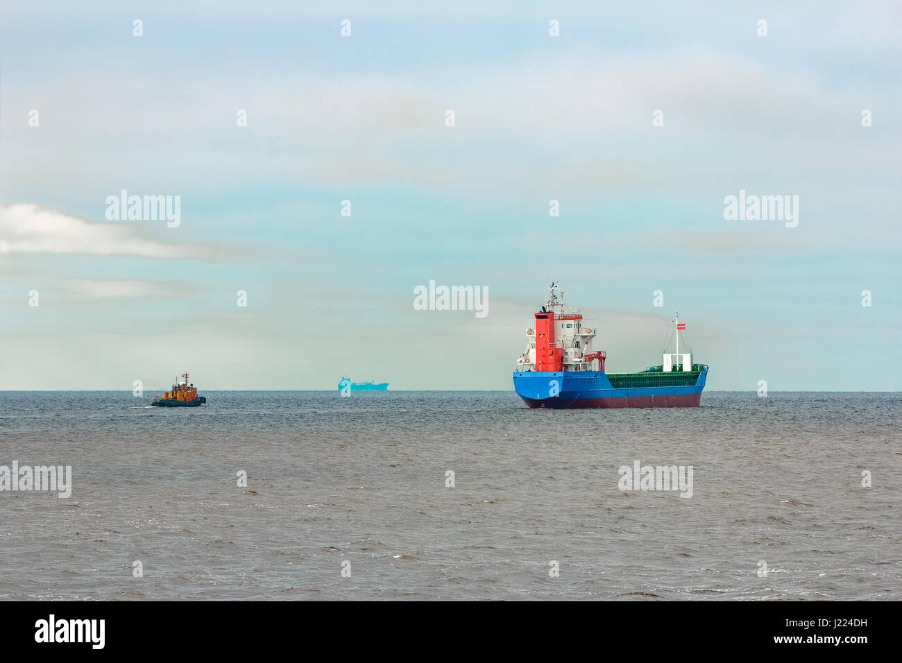 Blue cargo ship entering the Baltic sea. Riga, Europe Stock Photo - Alamy