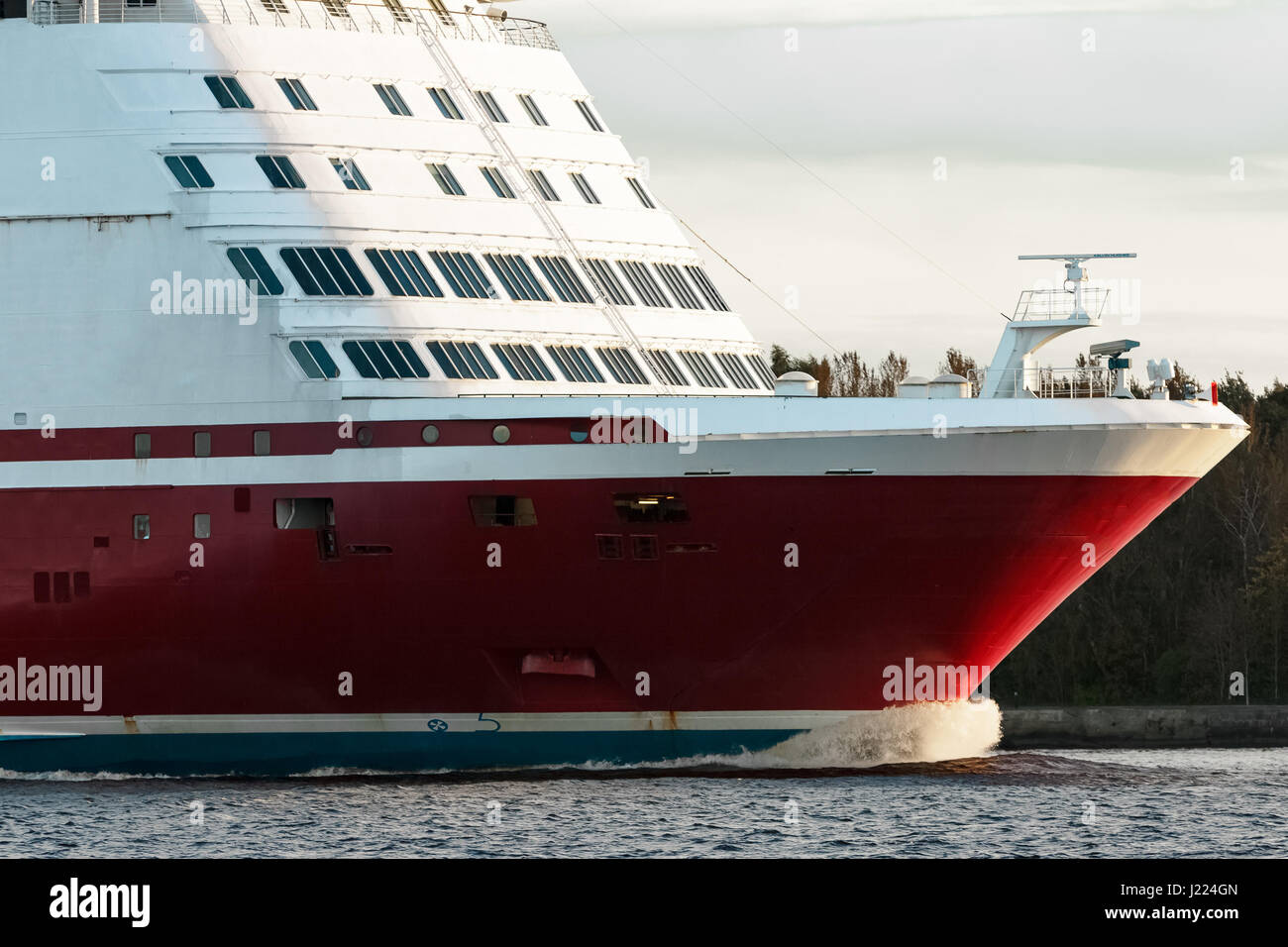 Red cruise liner's bow. Passenger ferry underway close up Stock Photo ...